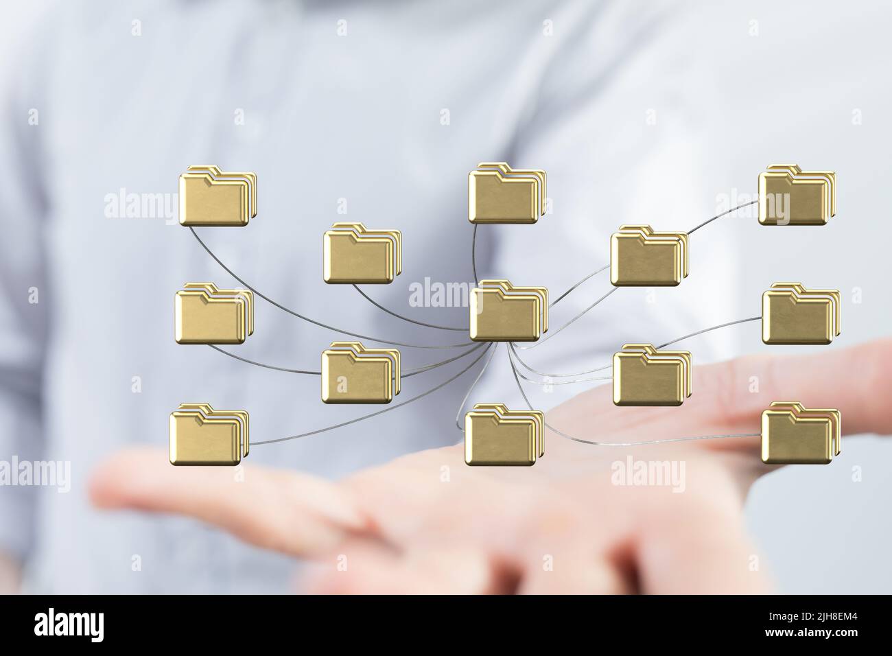 A man holding a floating render of a network connecting folders Stock ...