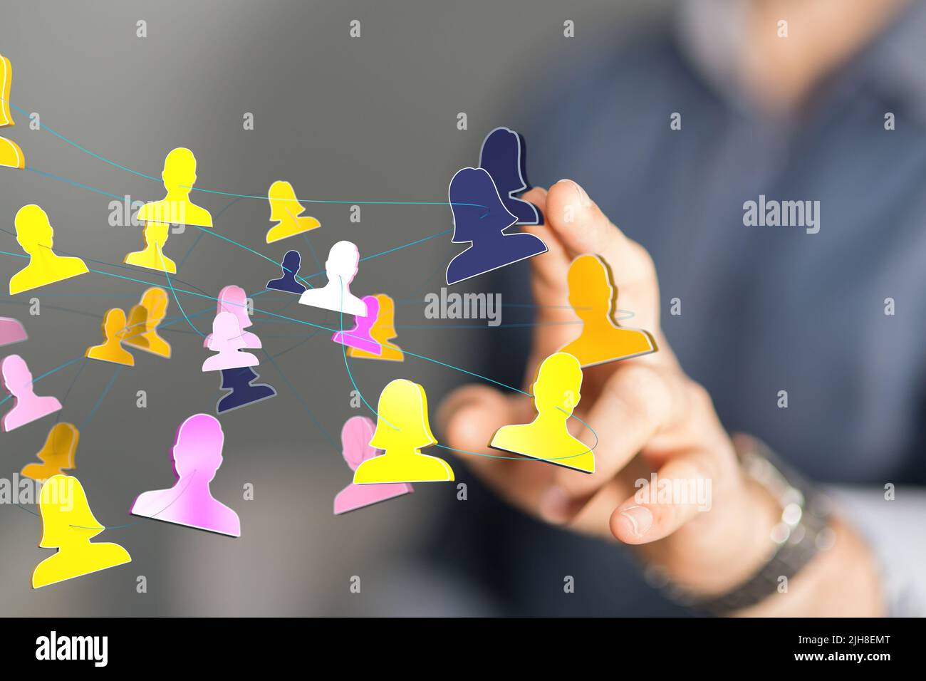 A man touching a floating render of a social network connecting people ...