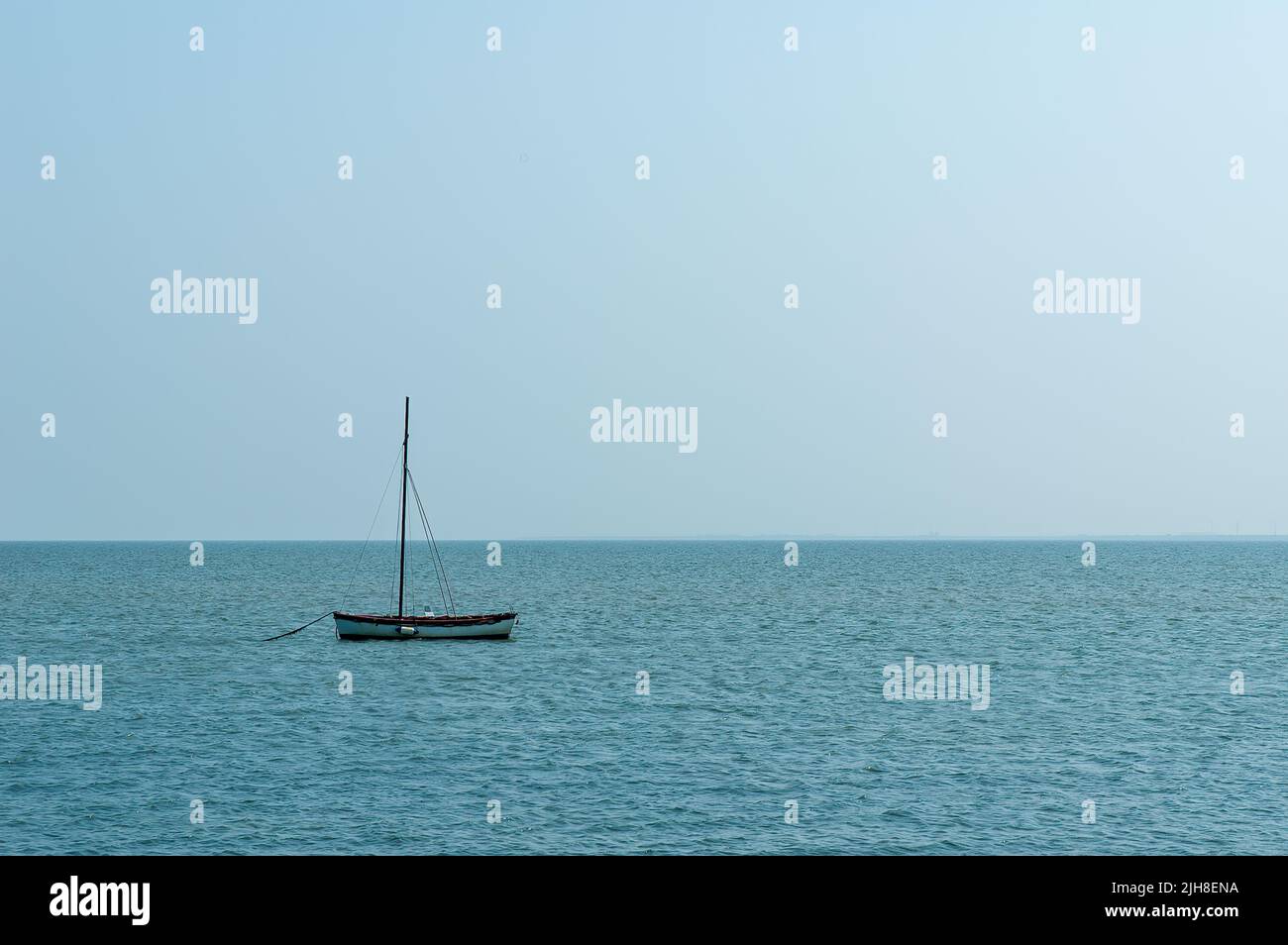 An empty boat in the northern sea on the island of Hallig Hooge in ...