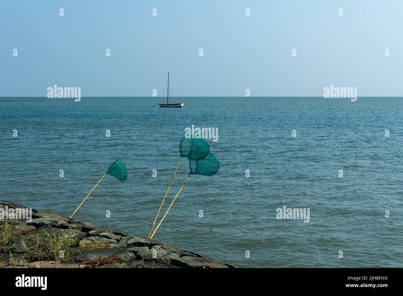 The landing nets on the sea shore with the background of the North Sea ...