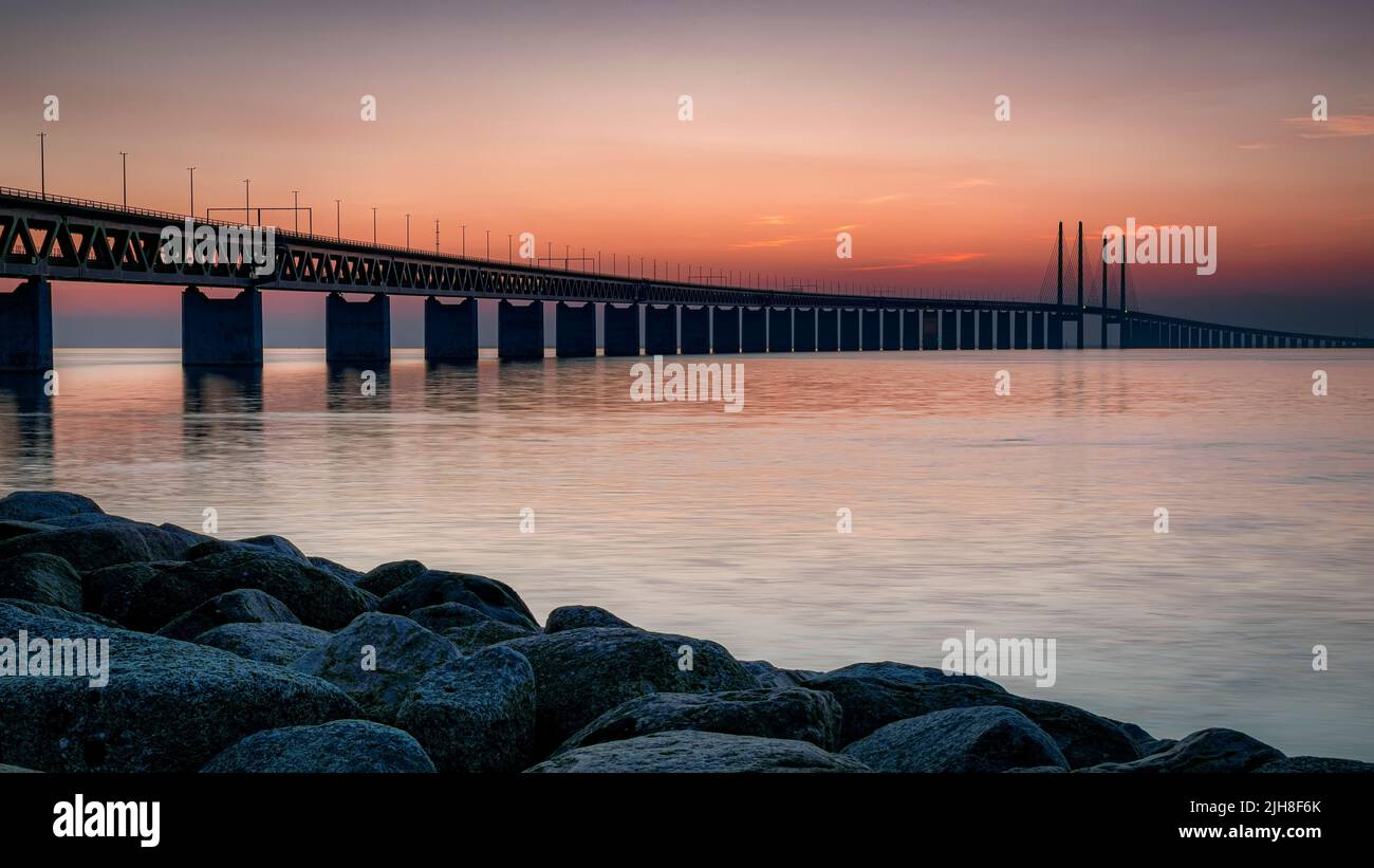 The sunset view from the Malmo coast -The Oresund Bridge crossing over ...
