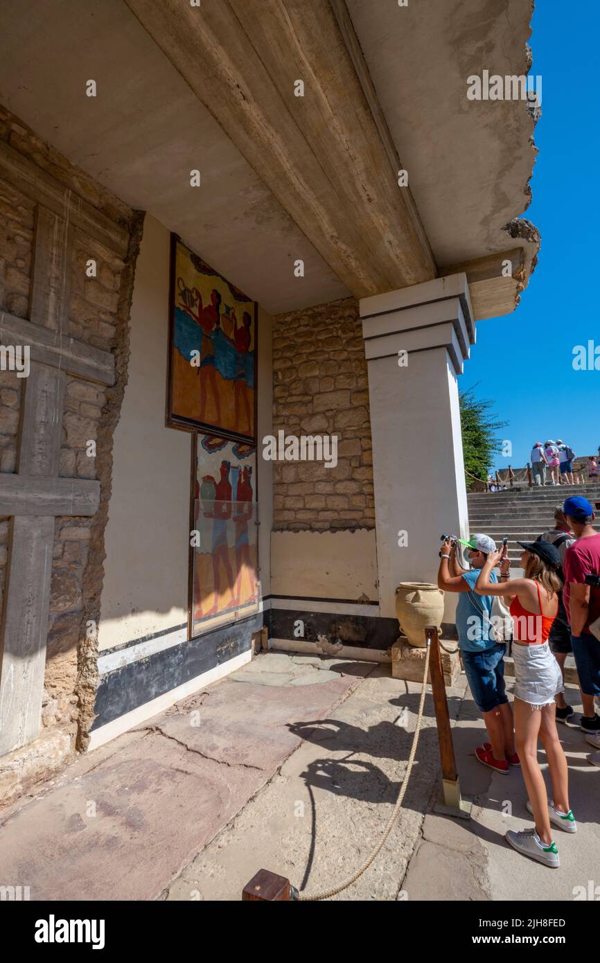 visitors to the ancient greek minoan site of the old temple at knossos ...