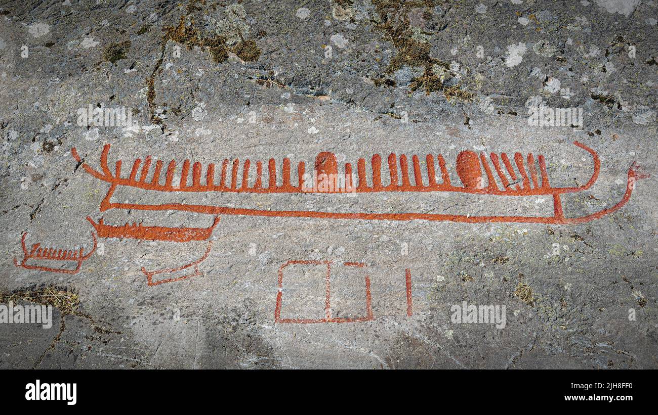A closeup shot of a rock carving of a long boat in Himmelstalund ...