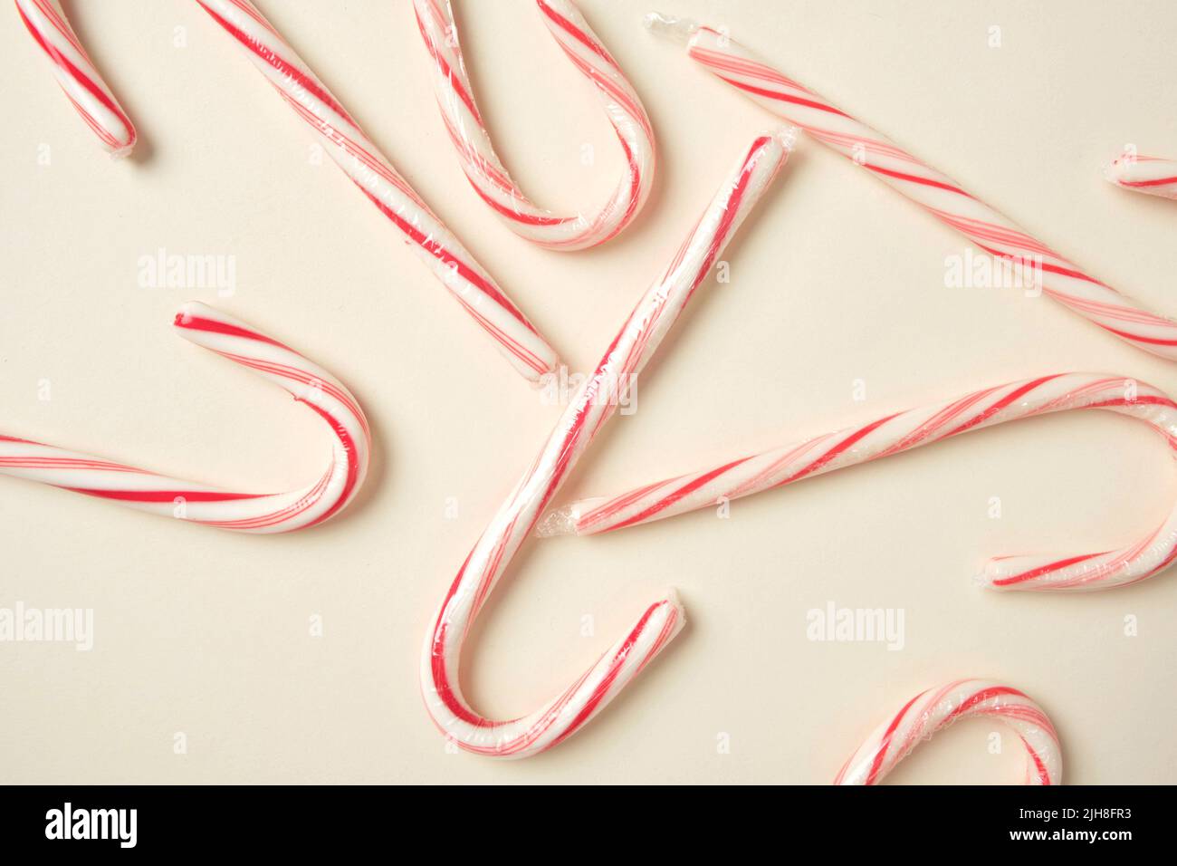 A Christmas candy-caramel cane on white background.Red and white two ...
