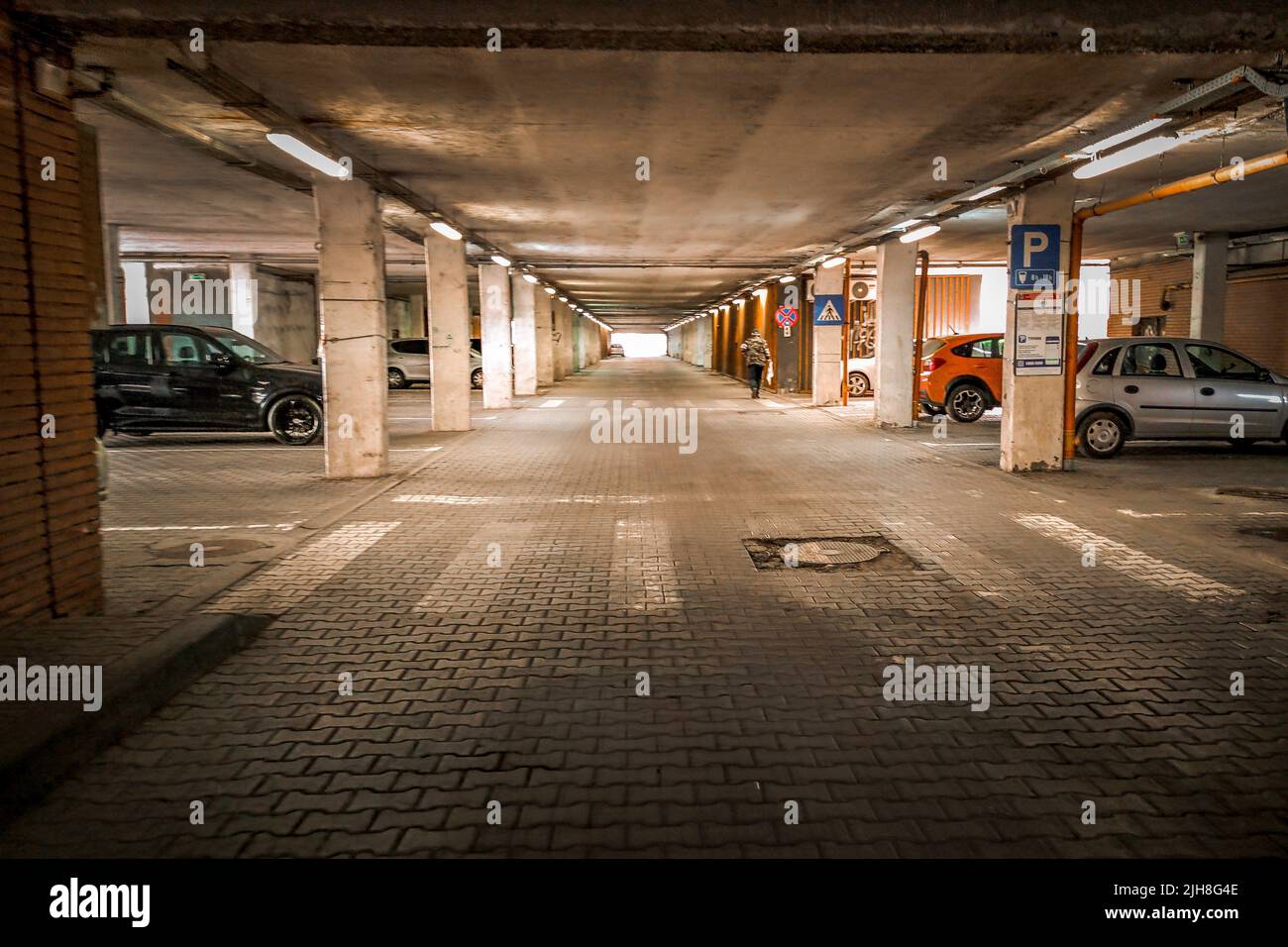 The underground parking with cars. Covered fully equipped modern ...