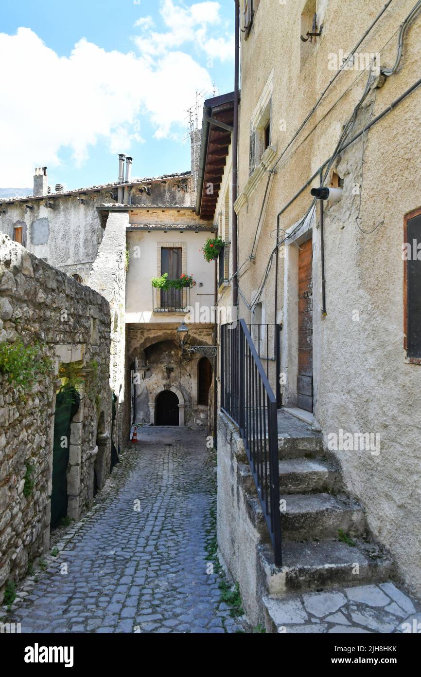A narrow street between the old stone houses of Campo di Giove, a ...