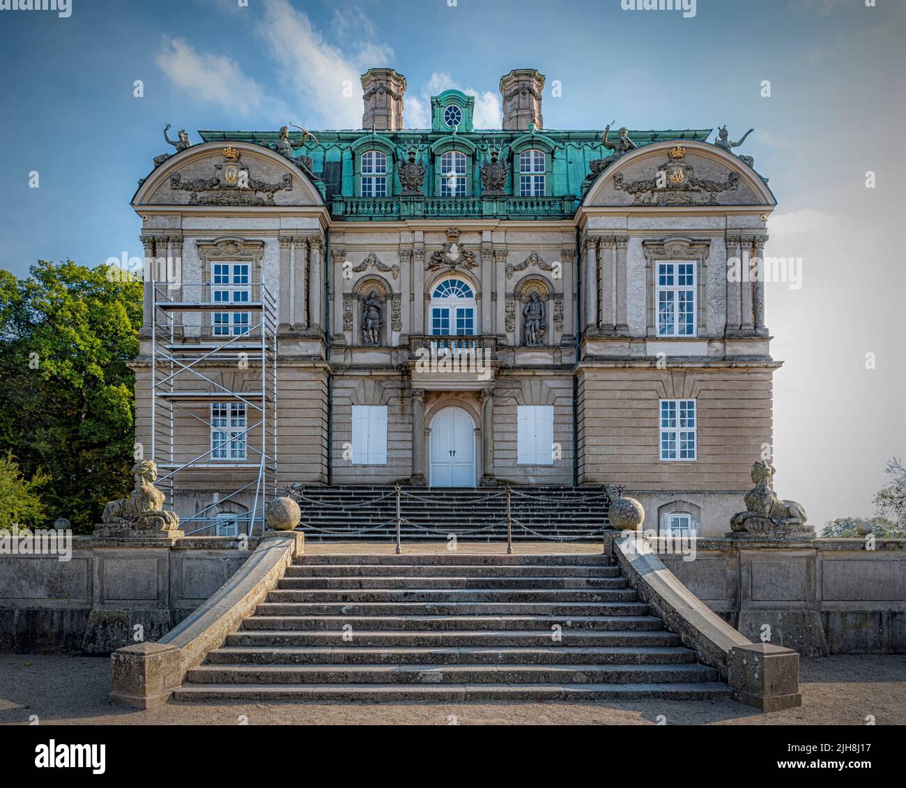 A beautiful view of Hermitage Palace at dyrehaven deer park in Denmark ...