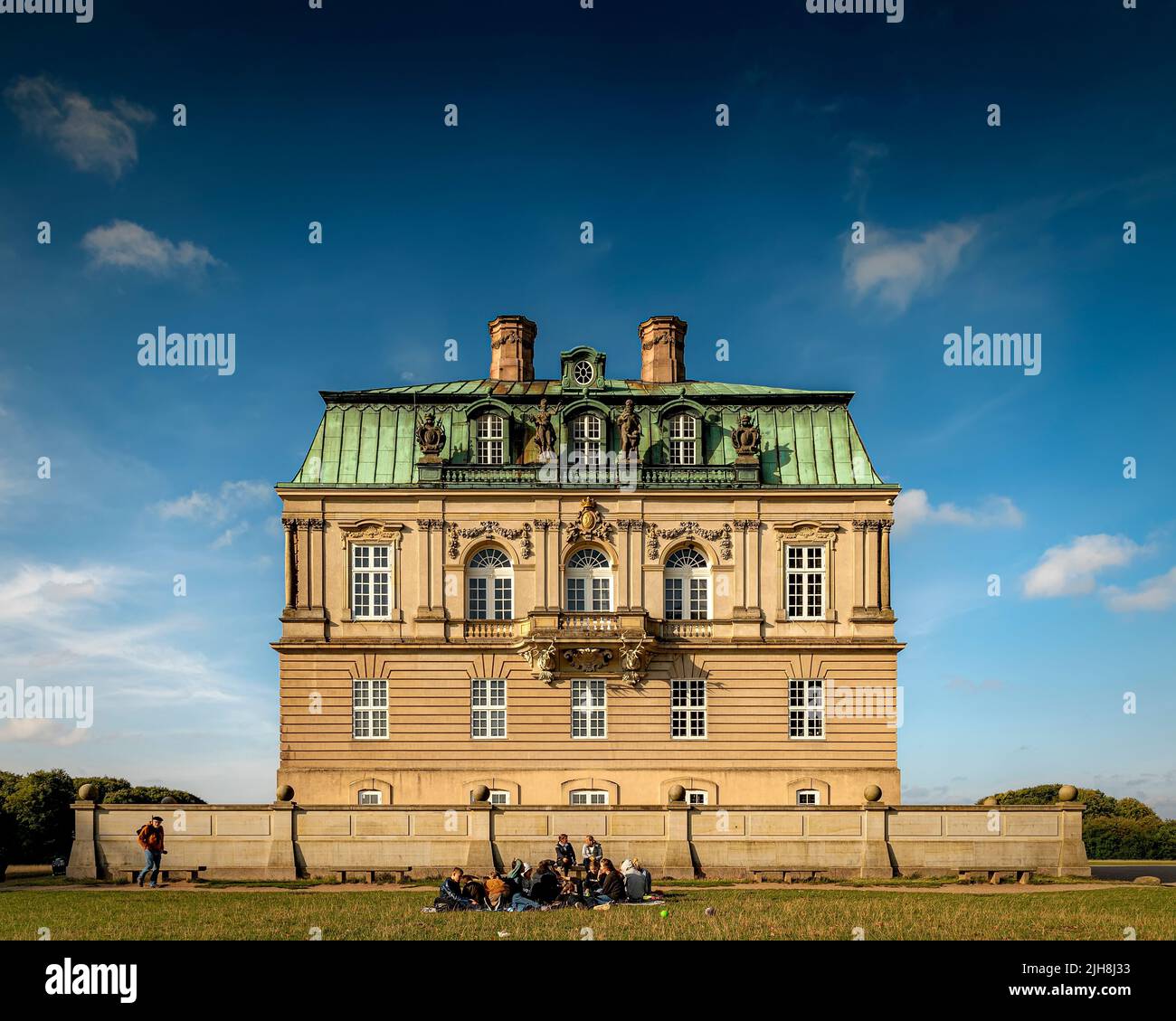 A beautiful view of Hermitage Palace at dyrehaven deer park in Denmark ...