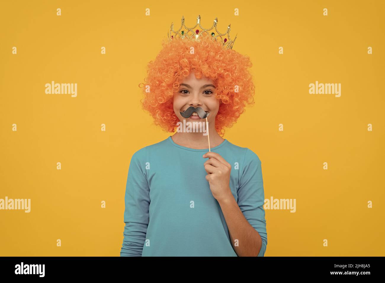 happy teen girl in fancy clown wig wear queen crown and funny party ...