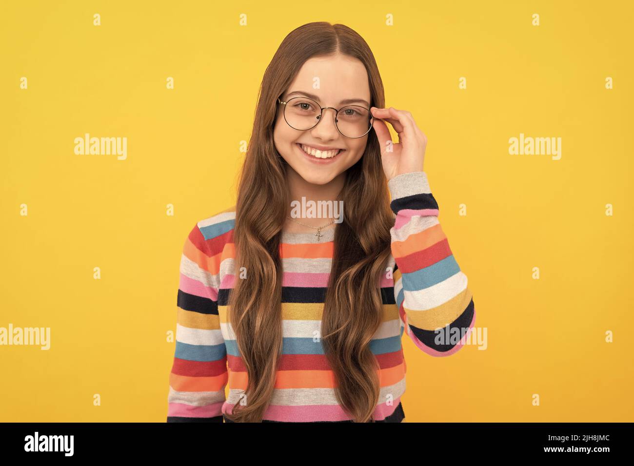 happy schoolgirl nerd child in eyeglasses for vision, vision correction Stock Photo - Alamy