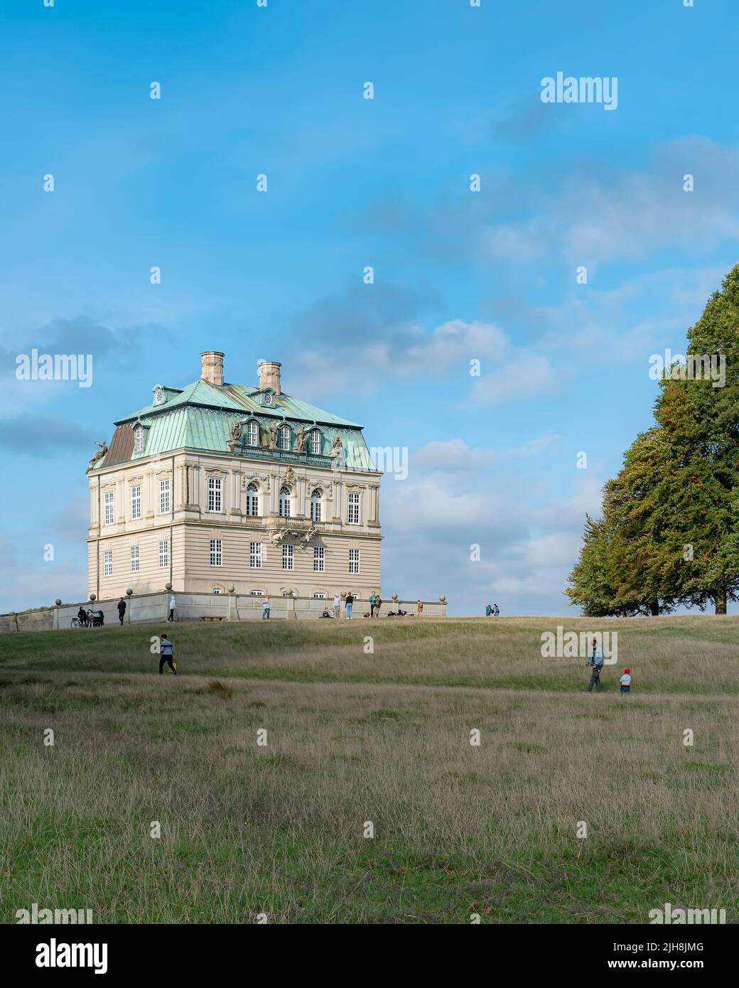A beautiful view of Hermitage Palace at dyrehaven deer park in Denmark ...