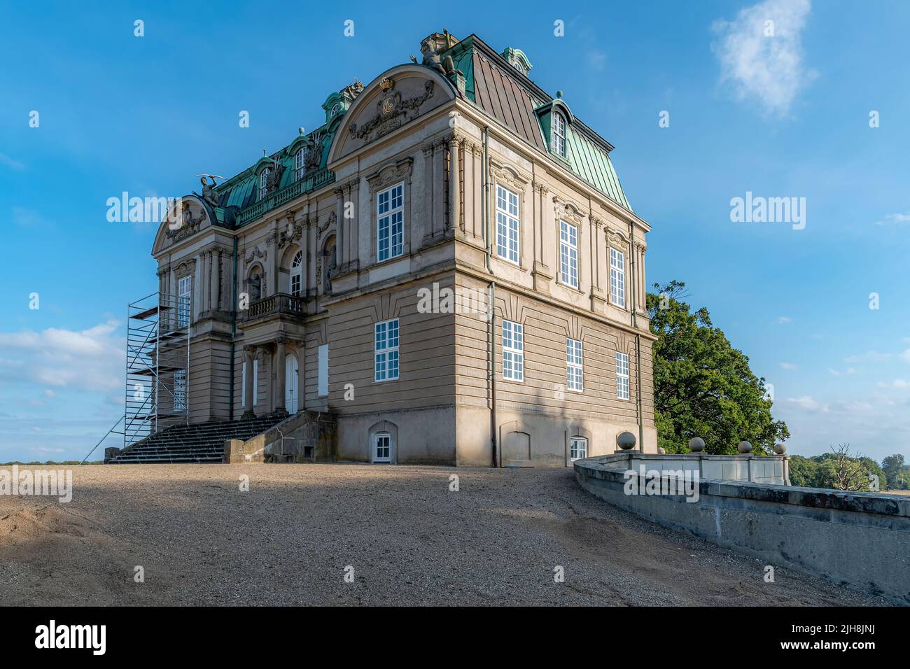 A beautiful view of Hermitage Palace at dyrehaven deer park in Denmark ...