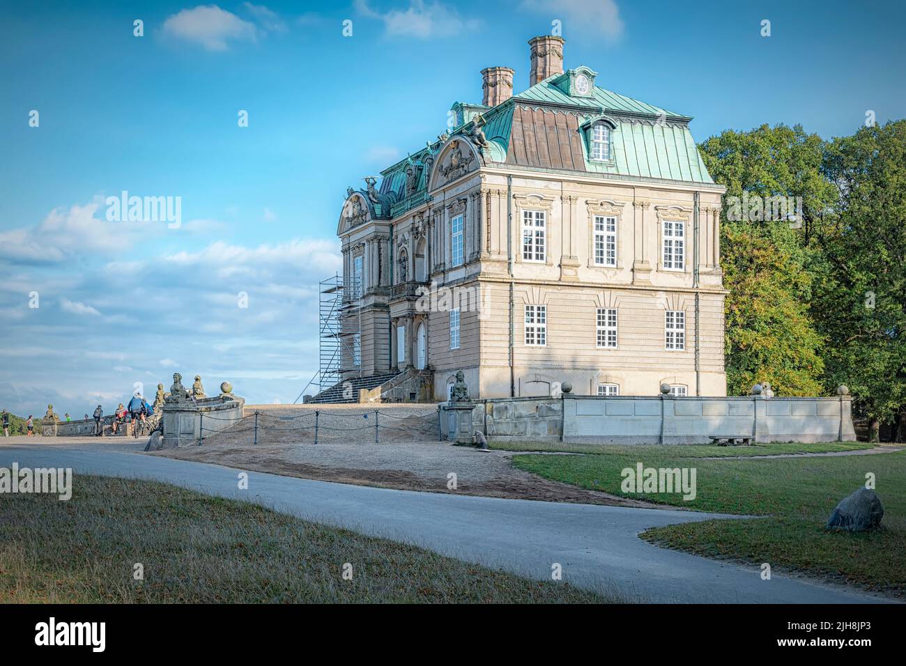 A beautiful view of Hermitage Palace at dyrehaven deer park in Denmark ...