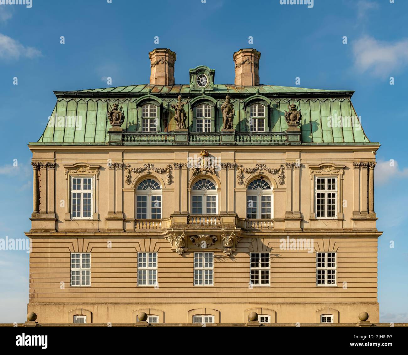 A beautiful view of Hermitage Palace at dyrehaven deer park in Denmark ...