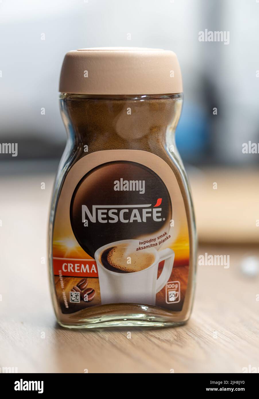 A vertical shot of Polish Nescafe Crema instant coffee in a glass jar ...