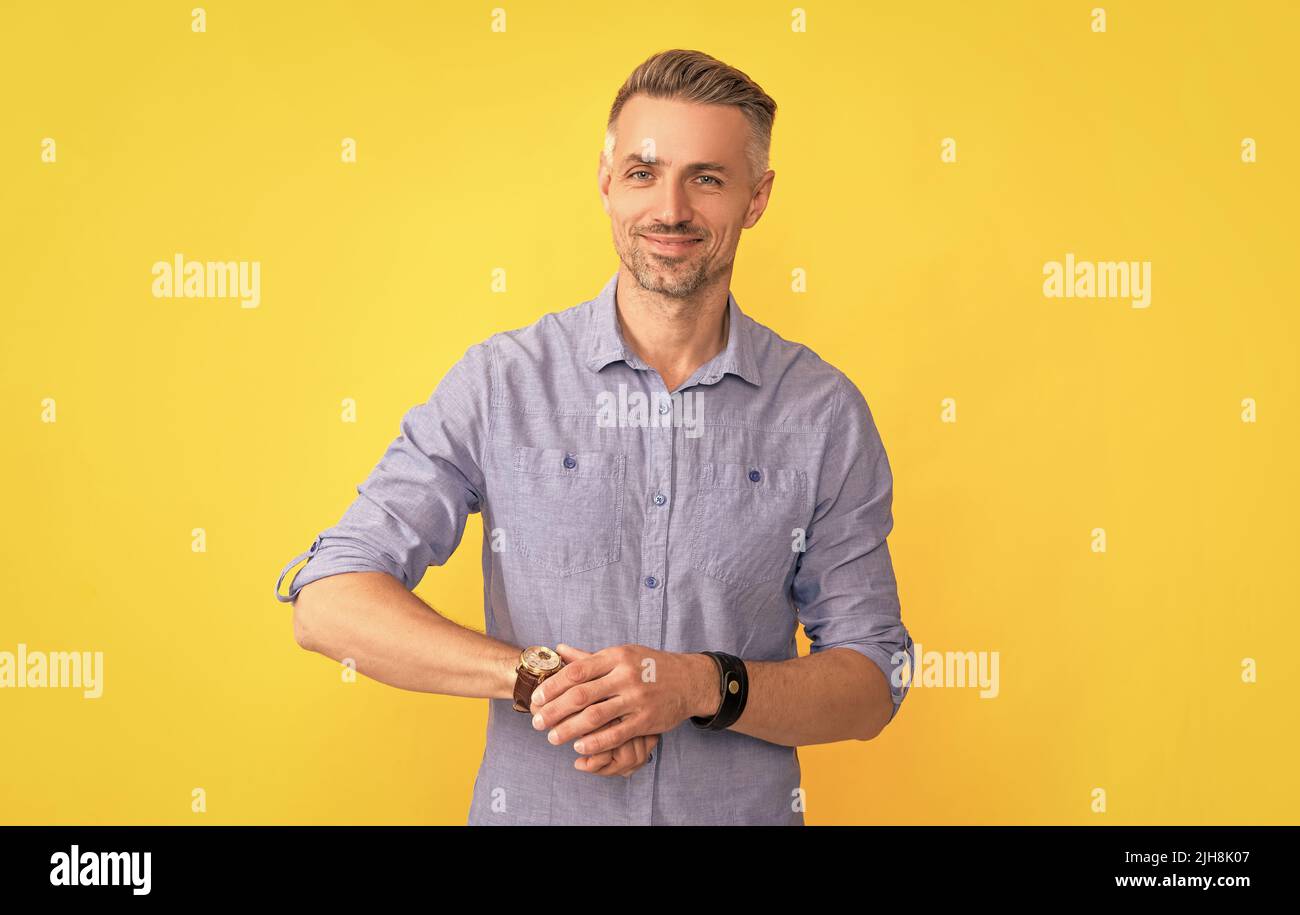 smiling man checking time. guy with hand watch. man showing wristwatch ...