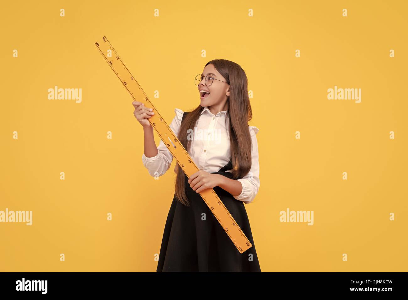 education for child. mathematics. laughing teen girl hold ruler. back ...