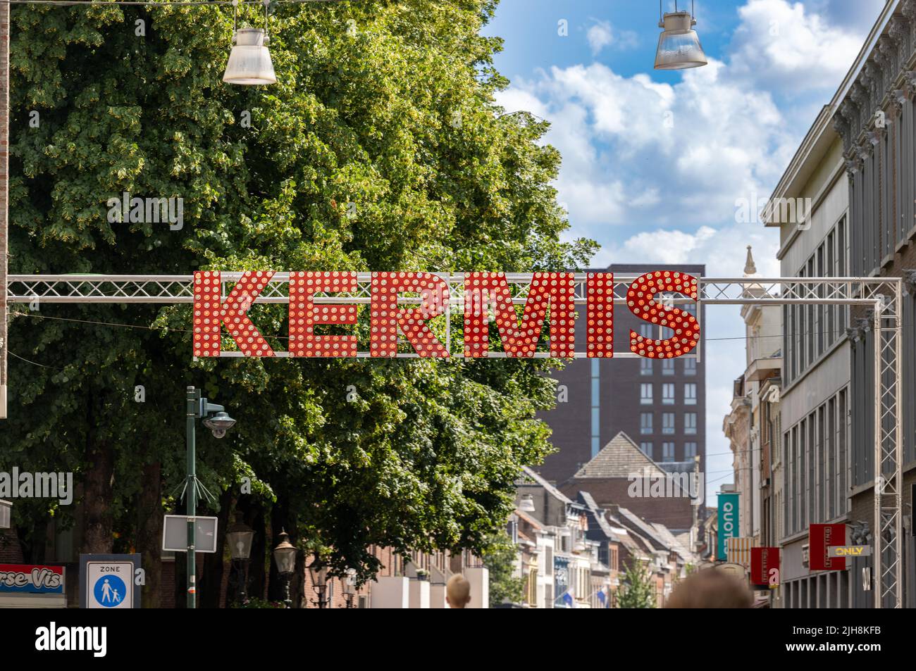 A kermis fair with lots of people walking Stock Photo - Alamy