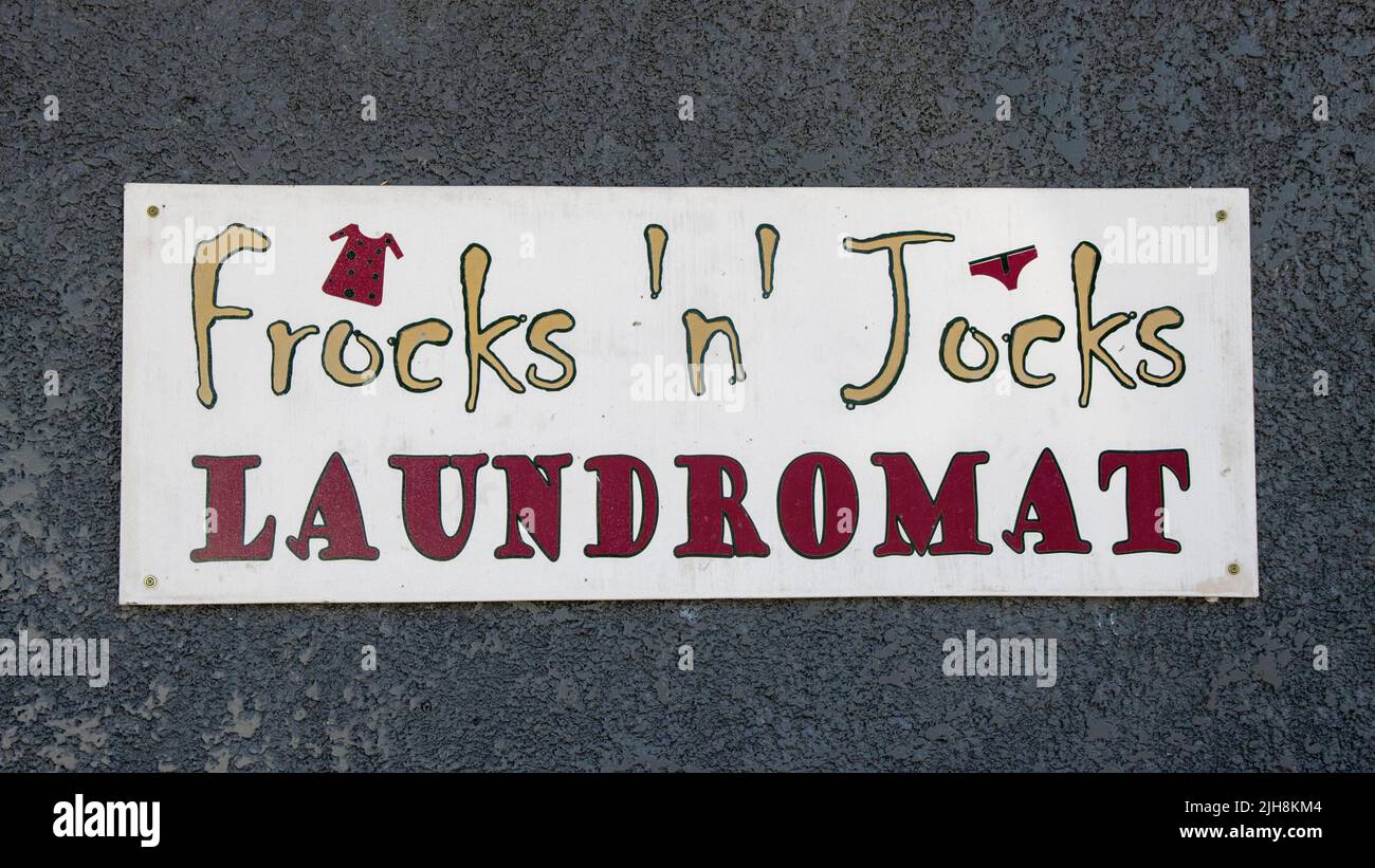 A funny sign "frocks n jocks laundromat" on the wall in Kenilworth ...