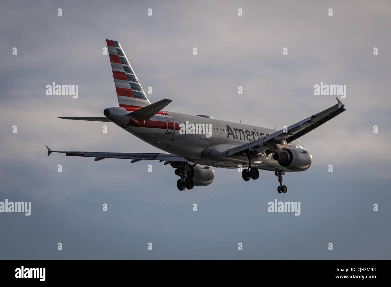 A view of a beautiful airplane flying high in the sky over Boston ...