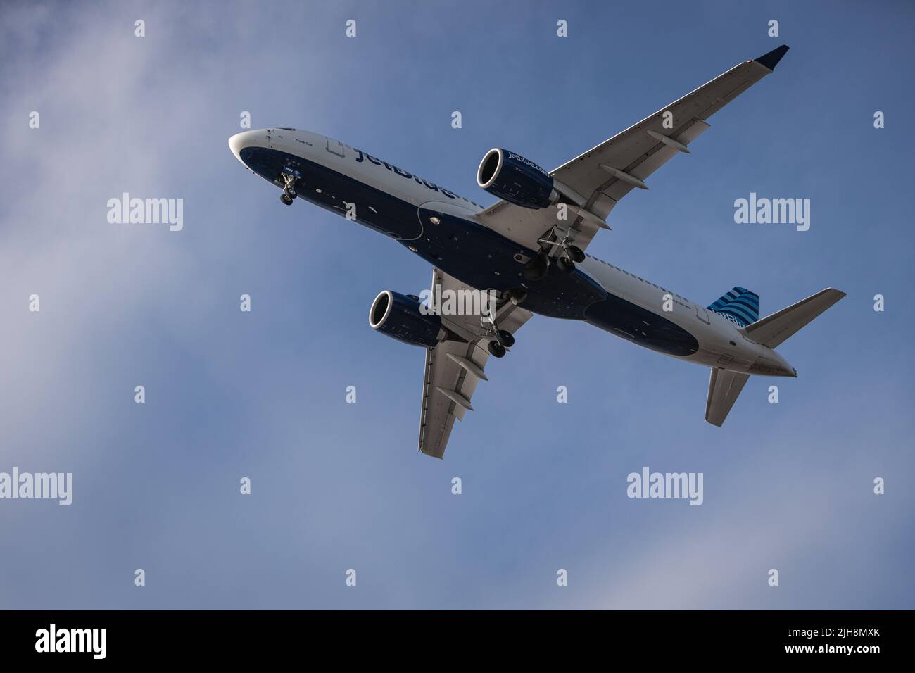 A view of a beautiful airplane flying high in the sky over Boston ...