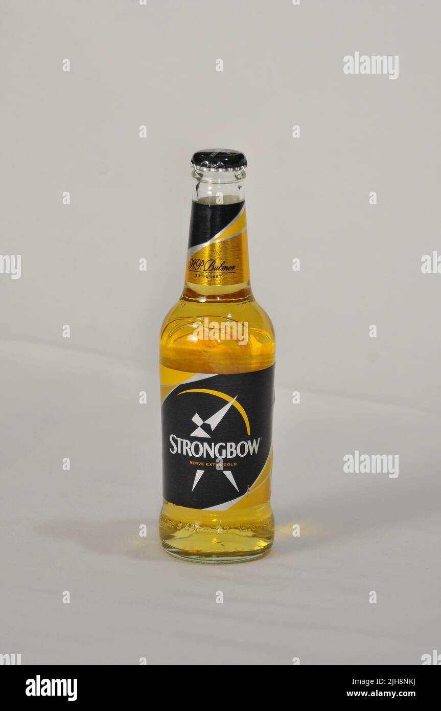 A vertical shot of a bottle of Strongbow dry cider in a studio in a ...