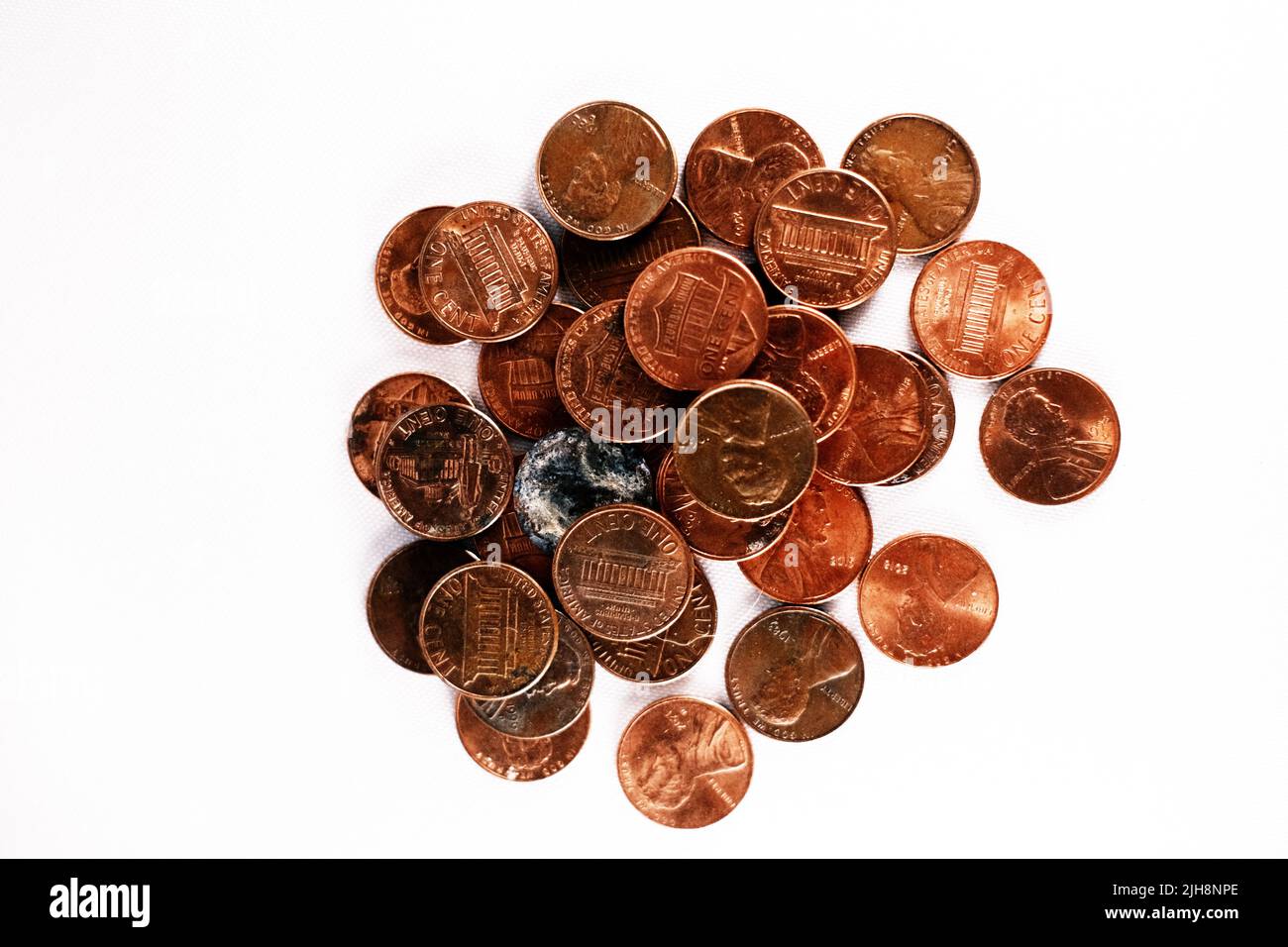 The top view of a pile of pennies against the white background Stock ...