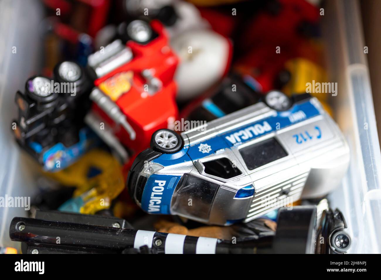 A pile of police and van cars in a full plastic container Stock Photo ...