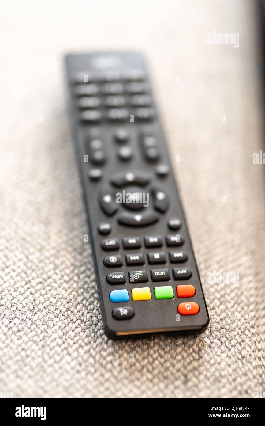 A TV remote control on a canvas surface Stock Photo - Alamy