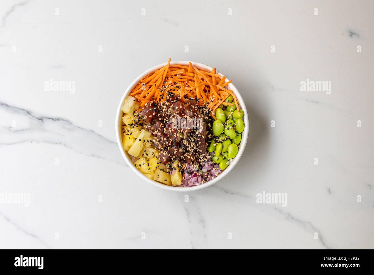 A bowl of poke with sesame seeds topping -healthy meal Stock Photo - Alamy