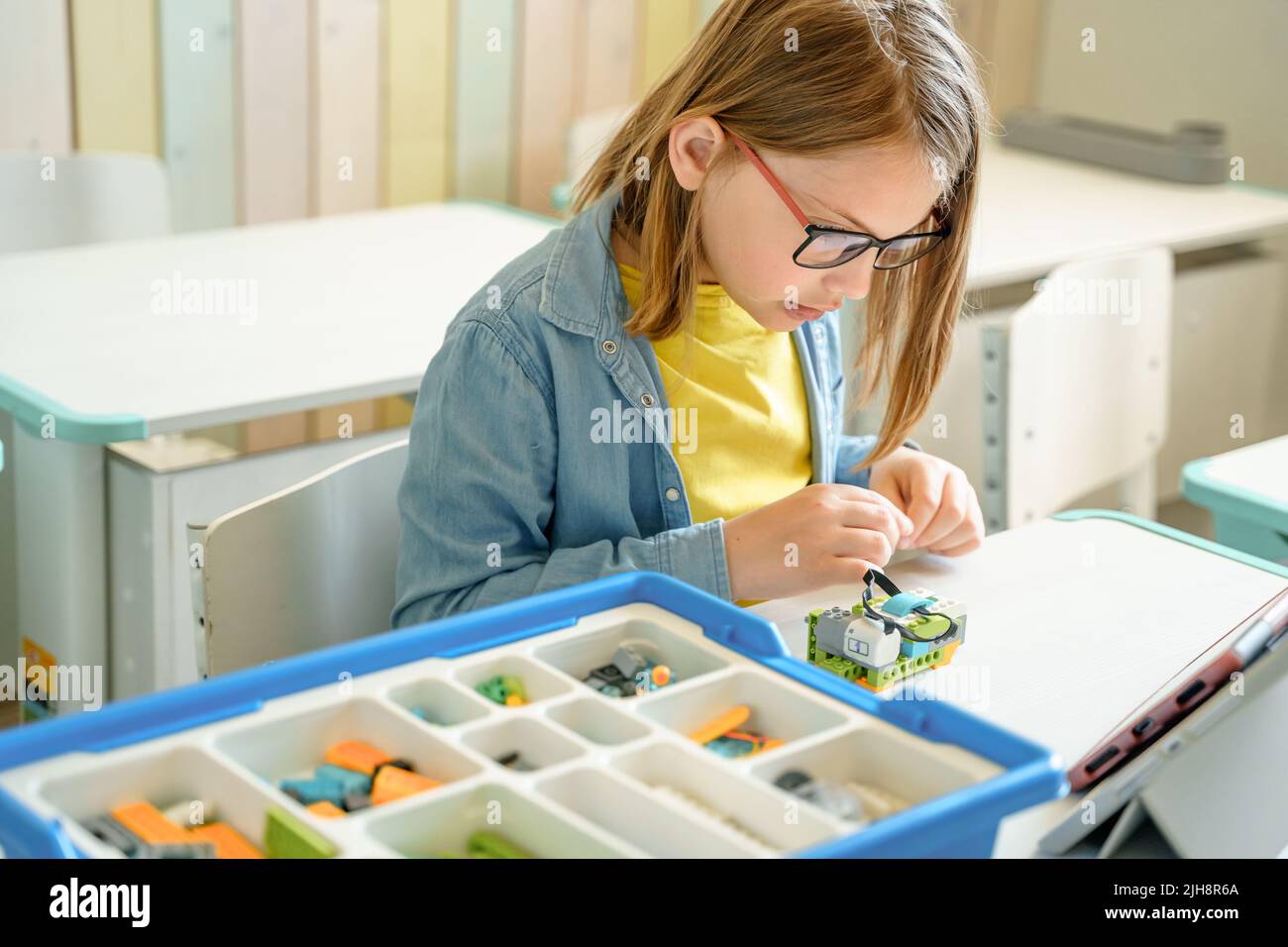 Programming work, learning robotics in elementary school. Children students assembly, launch ...