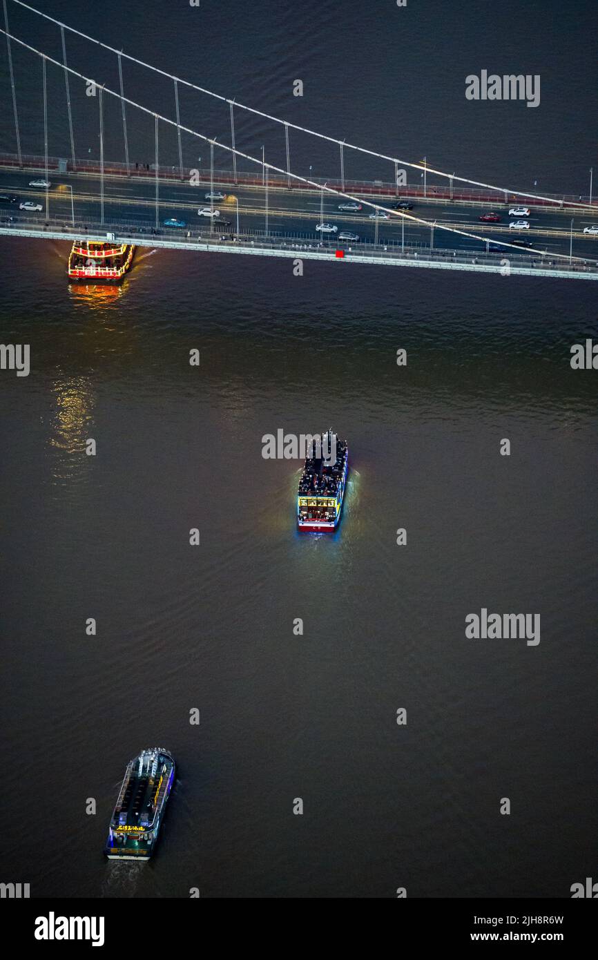 Three cruise ships crossing under the Bosphorus Bridge in Istanbul ...