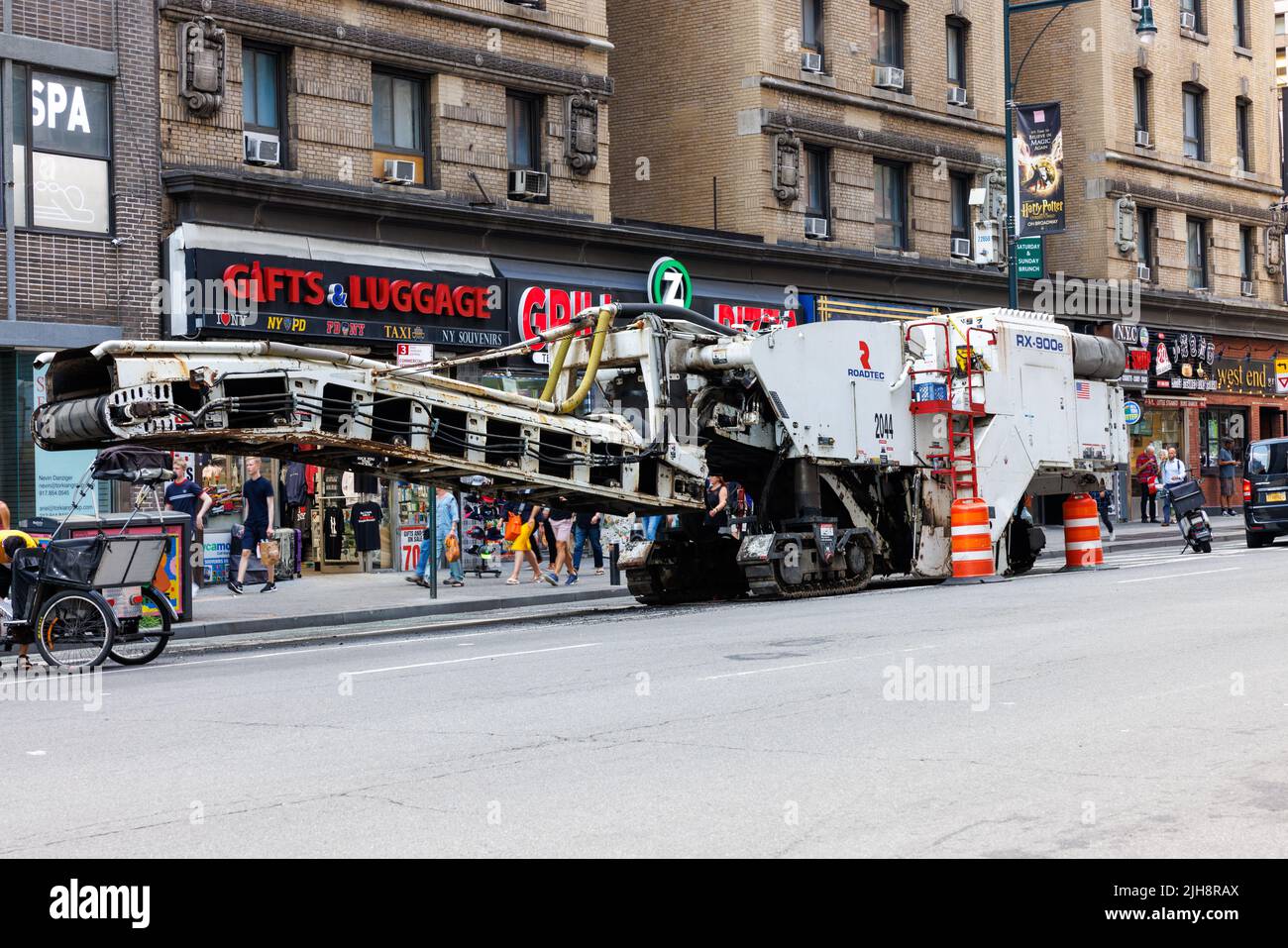 Thec Cold Planer paving new roads on 8th avenue in Manhattan Stock ...