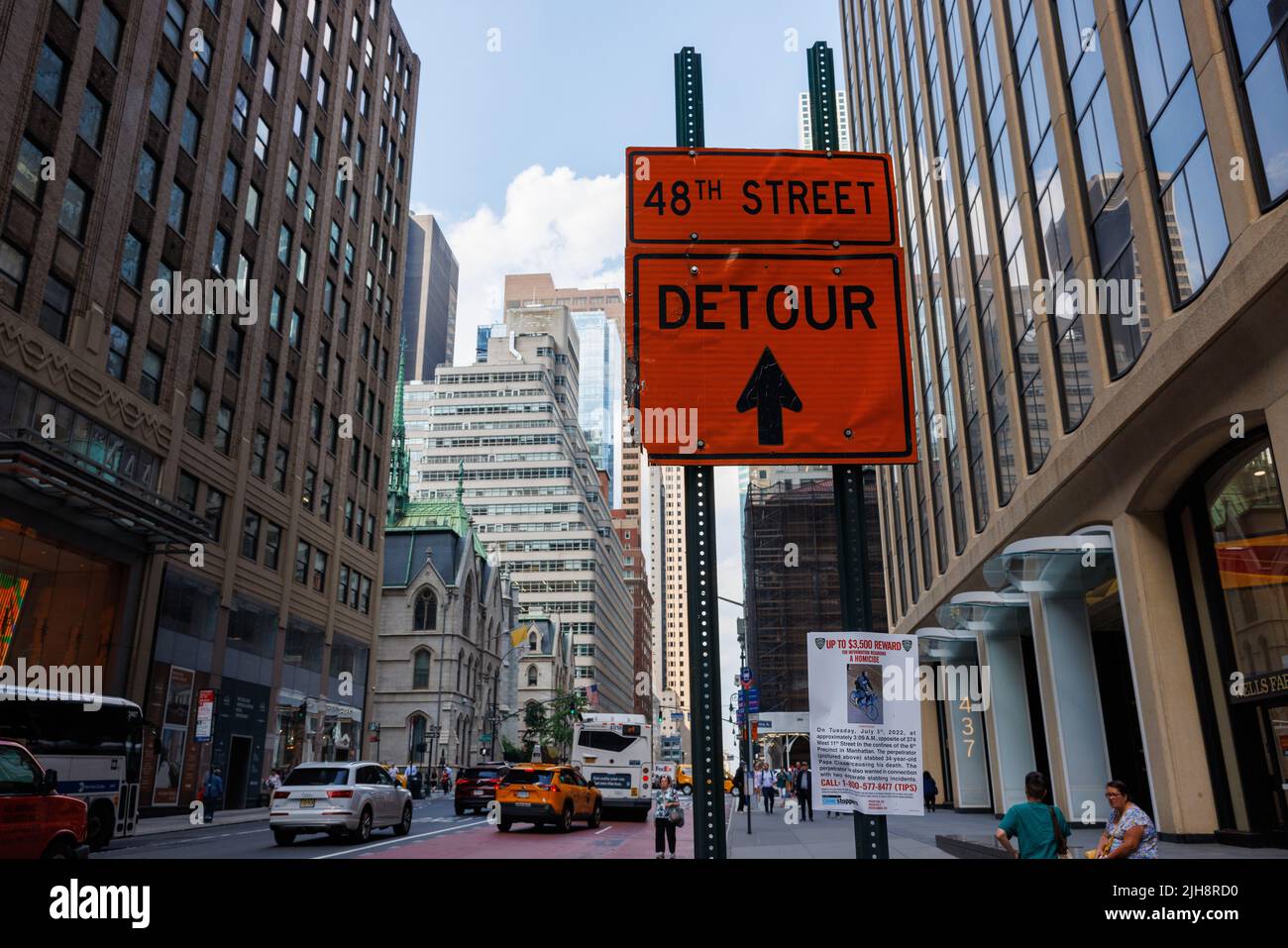A red rectangular traffic detour sign in Manhattan on 48th street and ...