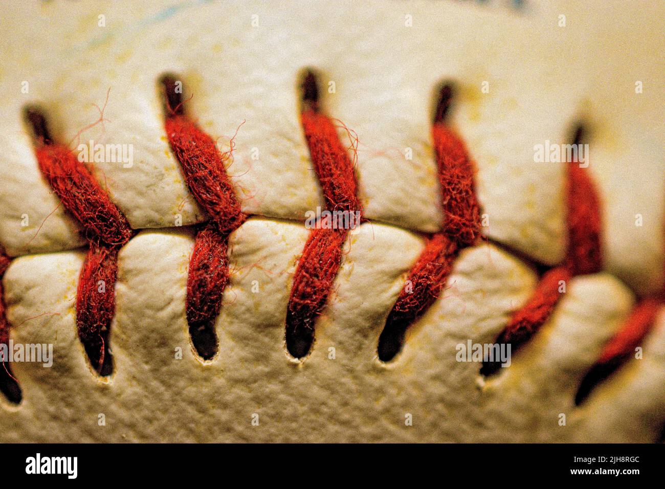 A closeup of red stitches on a baseball ball Stock Photo - Alamy