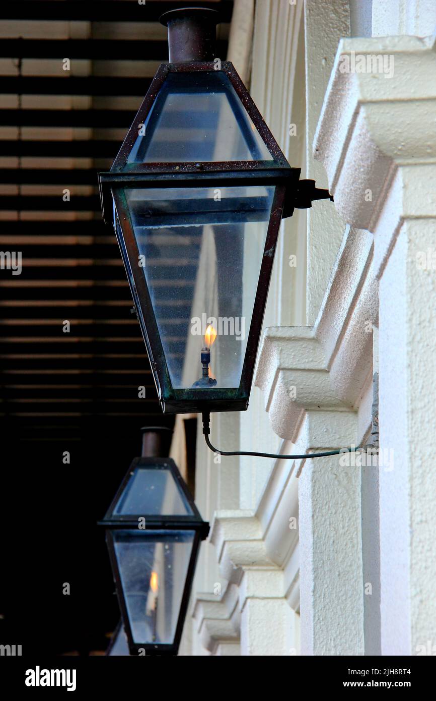 The street gas lamps on the facade of the building in New Orleans ...