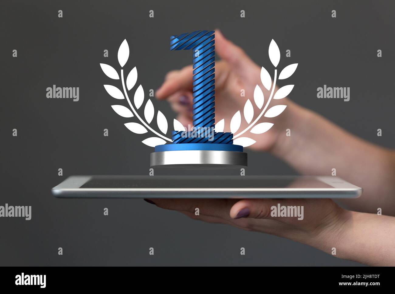 The hands holding a tablet with floating render of the first place ...