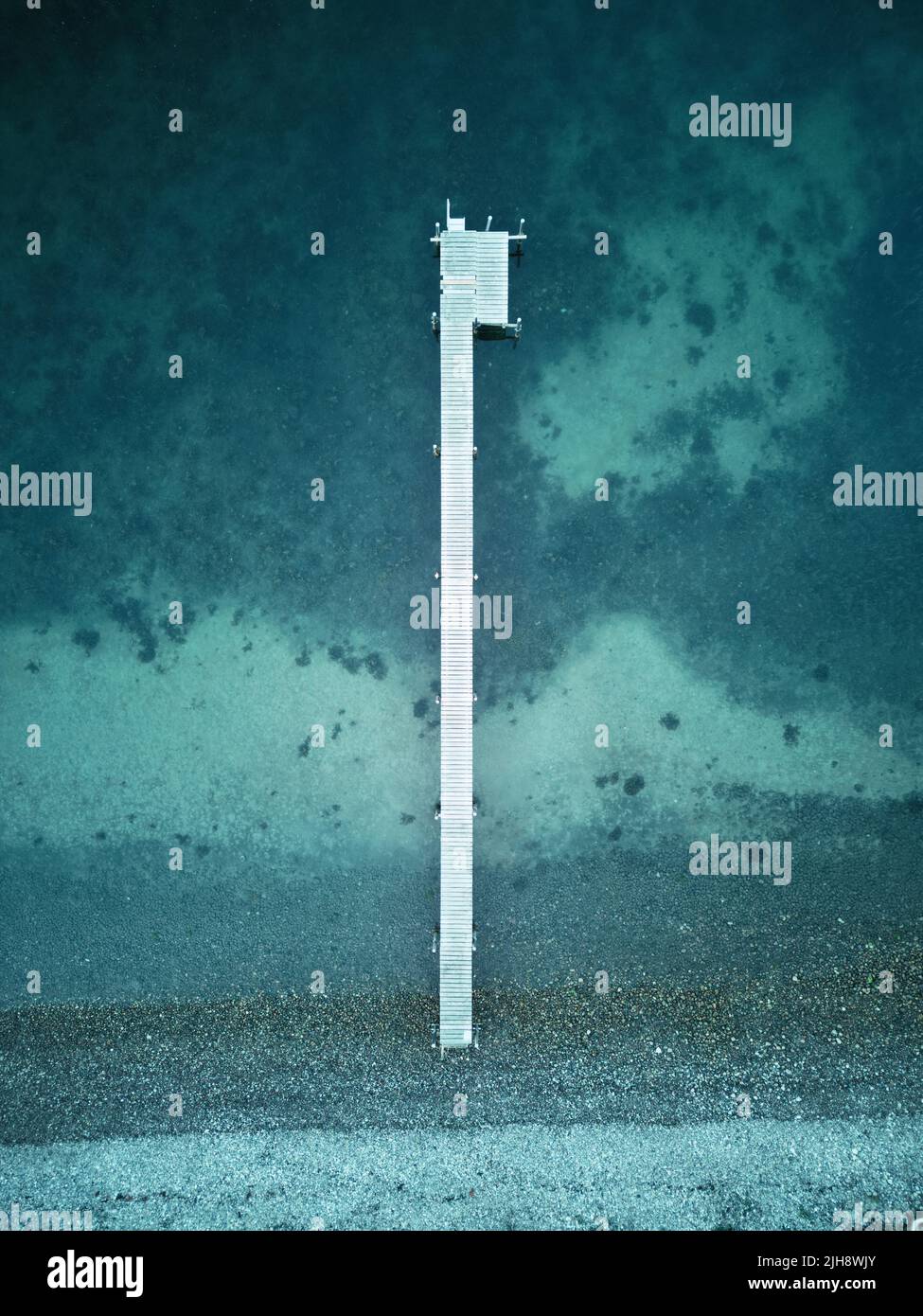 An aerial view of blue pier on the sea full of corals Stock Photo - Alamy