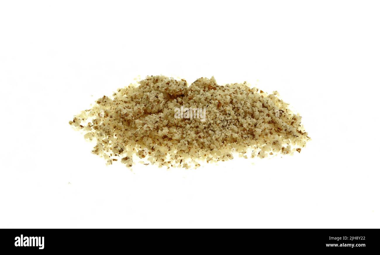 Ground walnuts powder on white. Chopped walnuts pile isolated on white ...