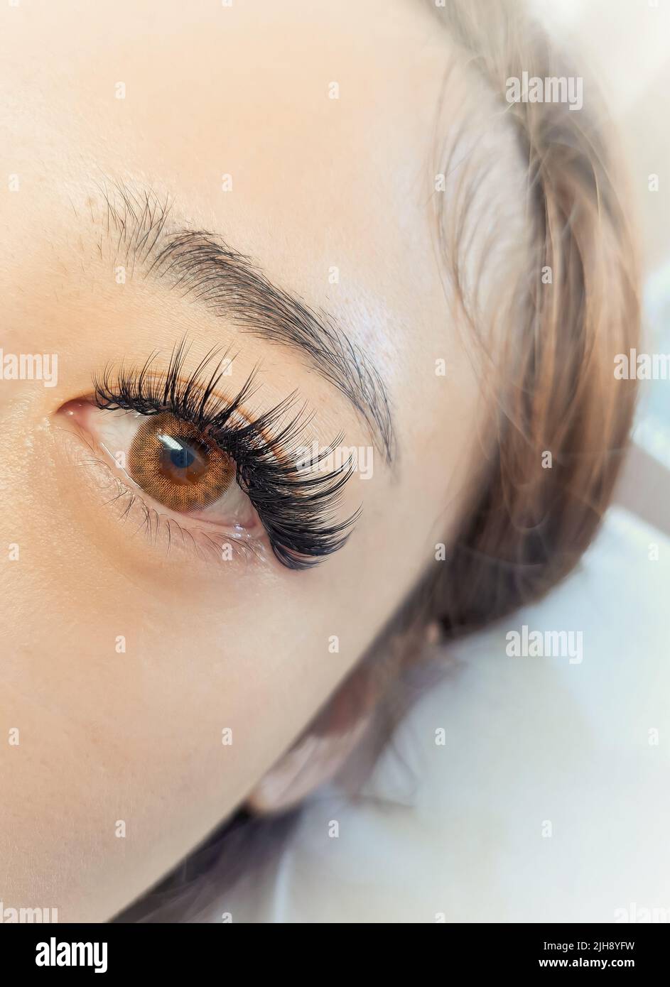 Lash extensions in beauty salon macro eye top view Stock Photo - Alamy