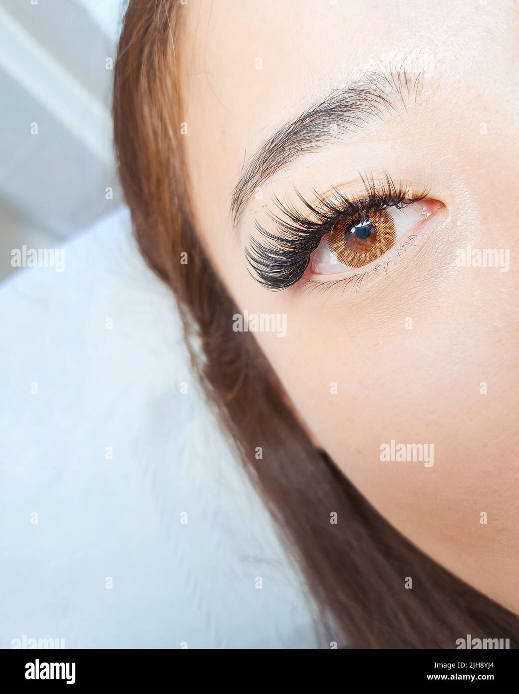 Lash extensions in beauty salon macro eye top view Stock Photo - Alamy