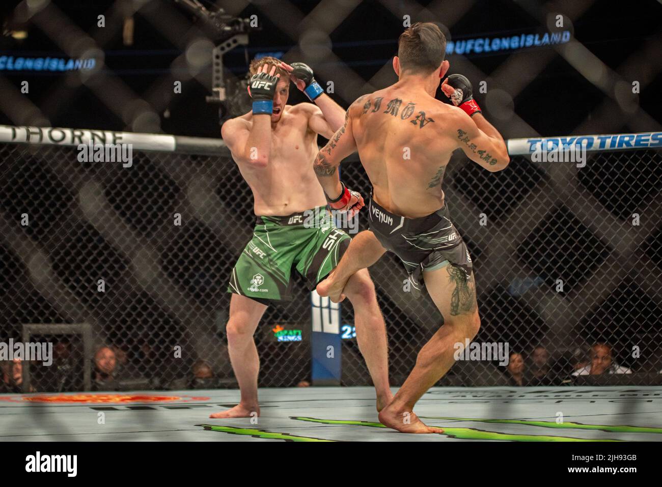 LONG ISLAND, NY - JULY 16: (R-L) Ricky Simon kicks Jack Shore in their Bantamweight bout during ...