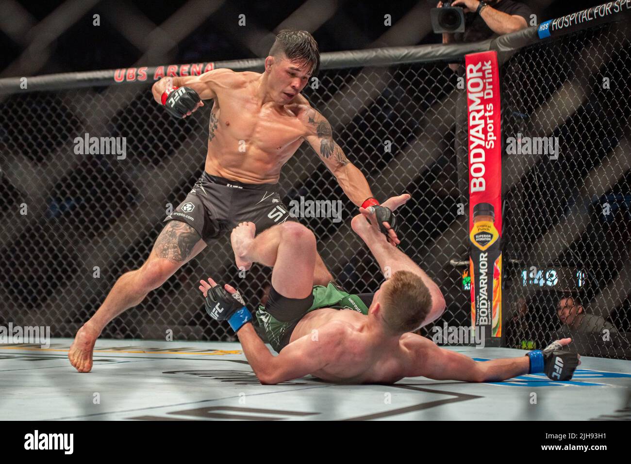 LONG ISLAND, NY - JULY 16: (L-R) Ricky Simon punches Jack Shore in their Bantamweight bout ...