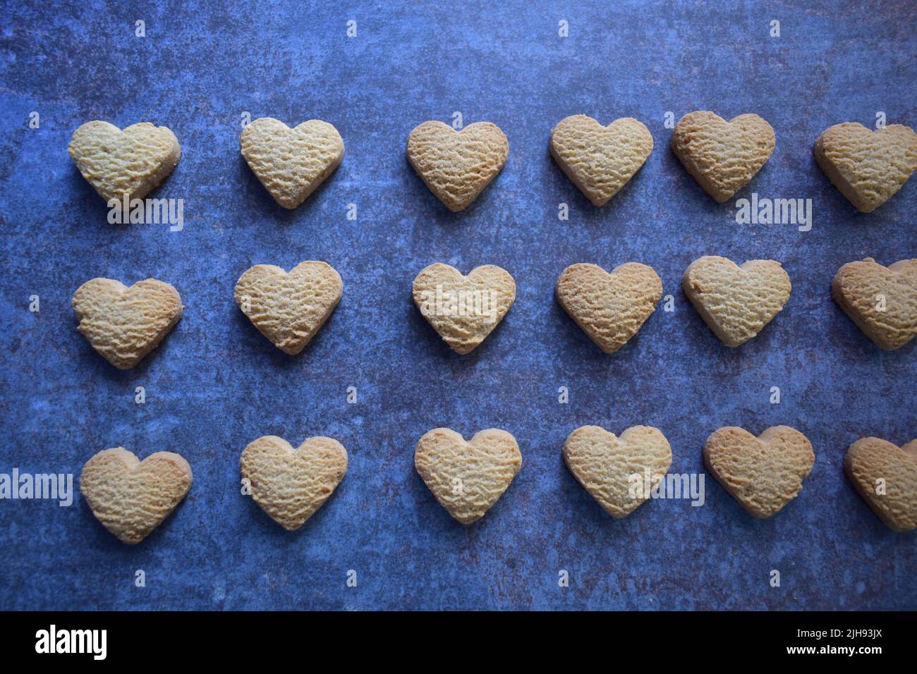 Crunchy fresh baked heart shape cookie Stock Photo - Alamy