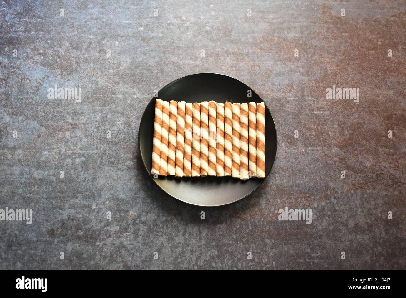 Crunchy fresh wafer roll cookie Stock Photo - Alamy