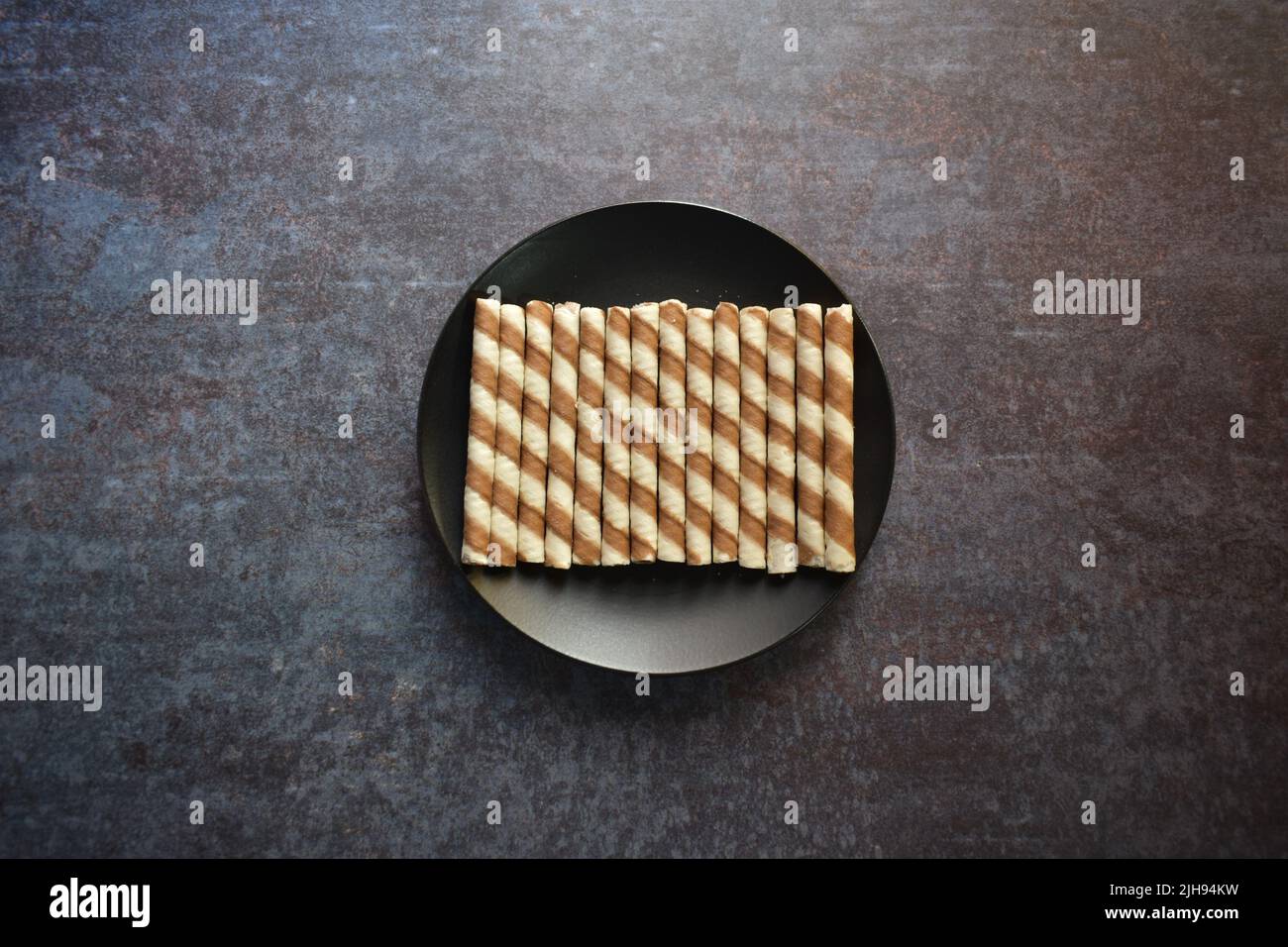 Crunchy fresh wafer roll cookie Stock Photo - Alamy