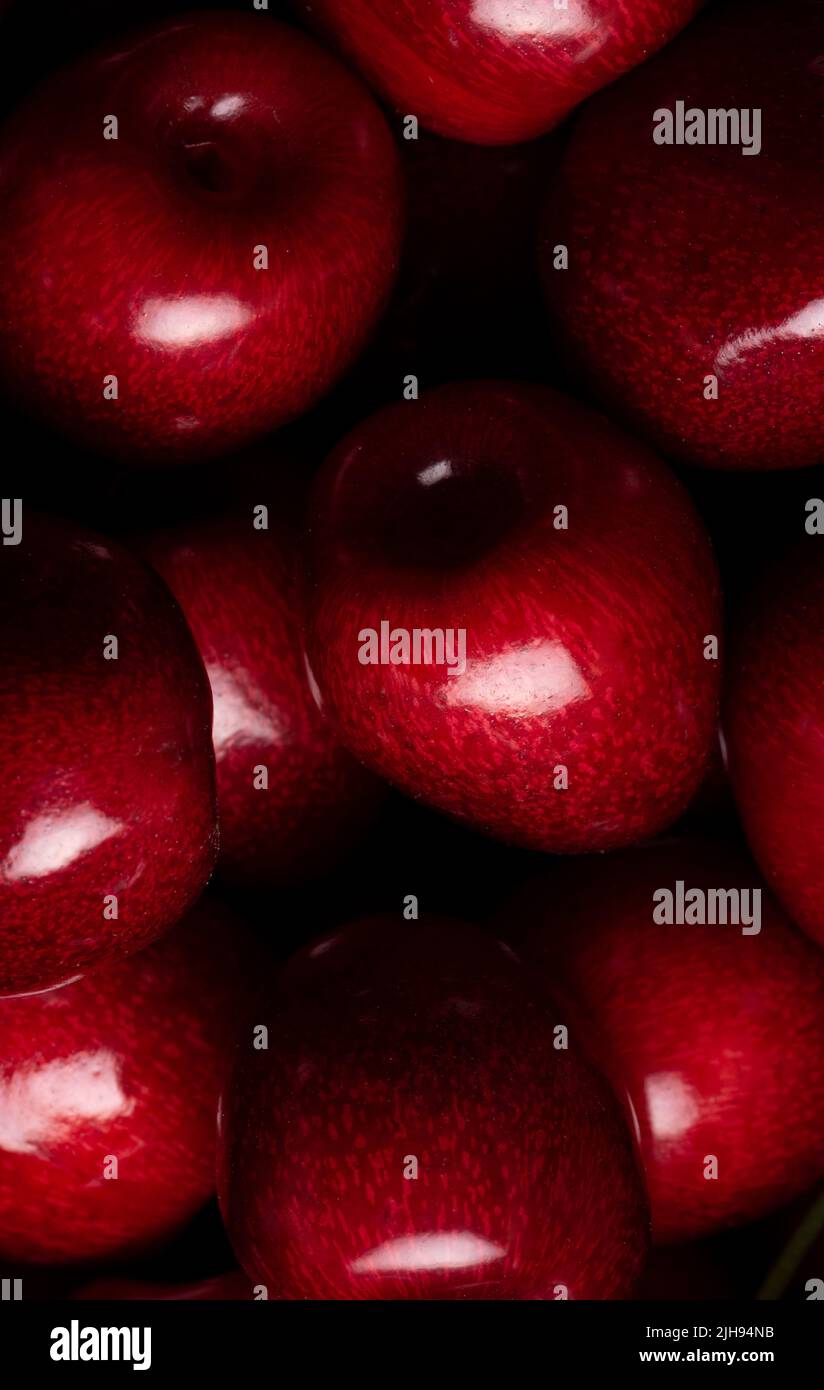 Red juicy sweet cherries. Juicy maroon fruit close-up. Cherries in ...