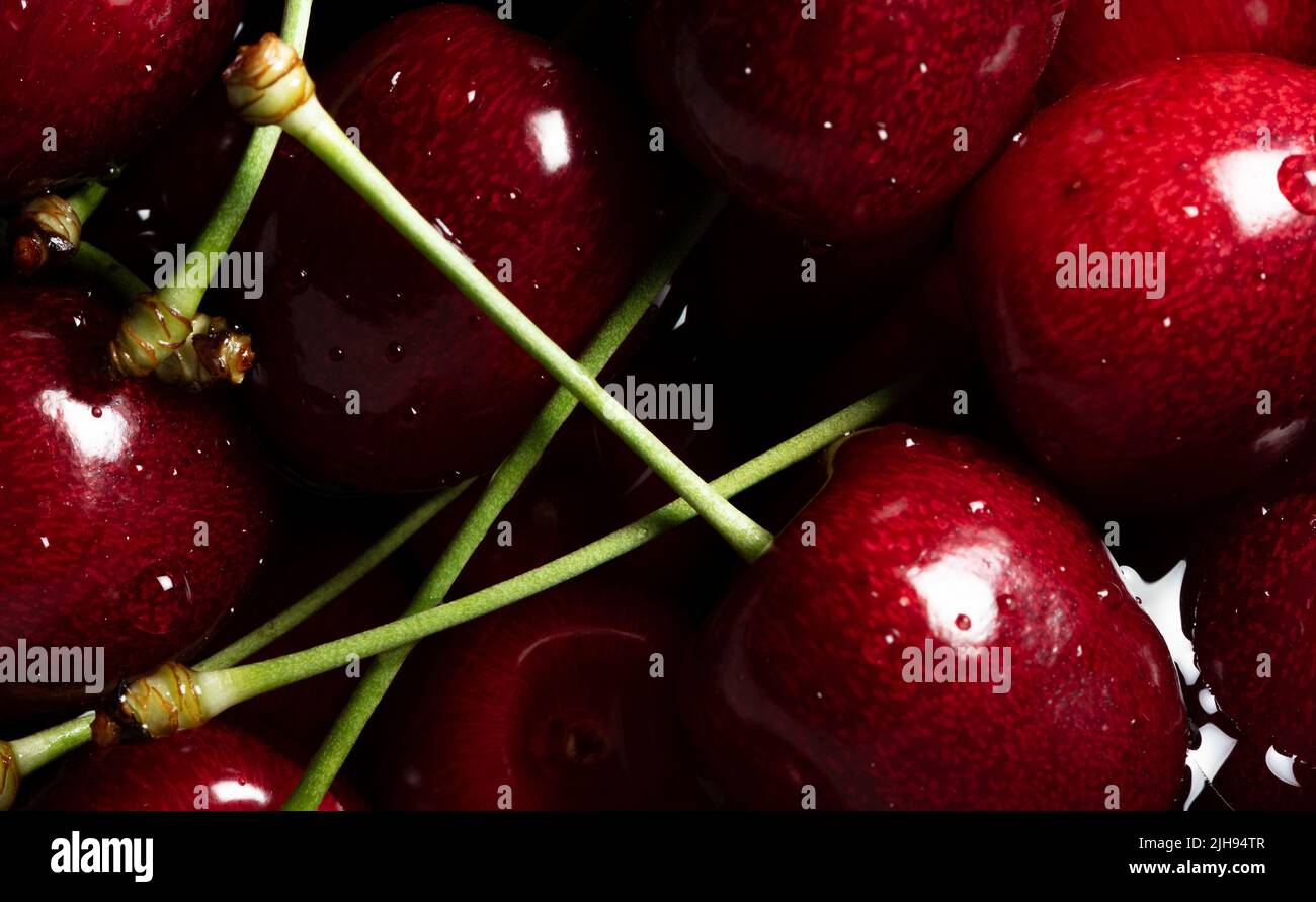 Red juicy sweet cherries. Juicy maroon fruit close-up. Cherries in ...