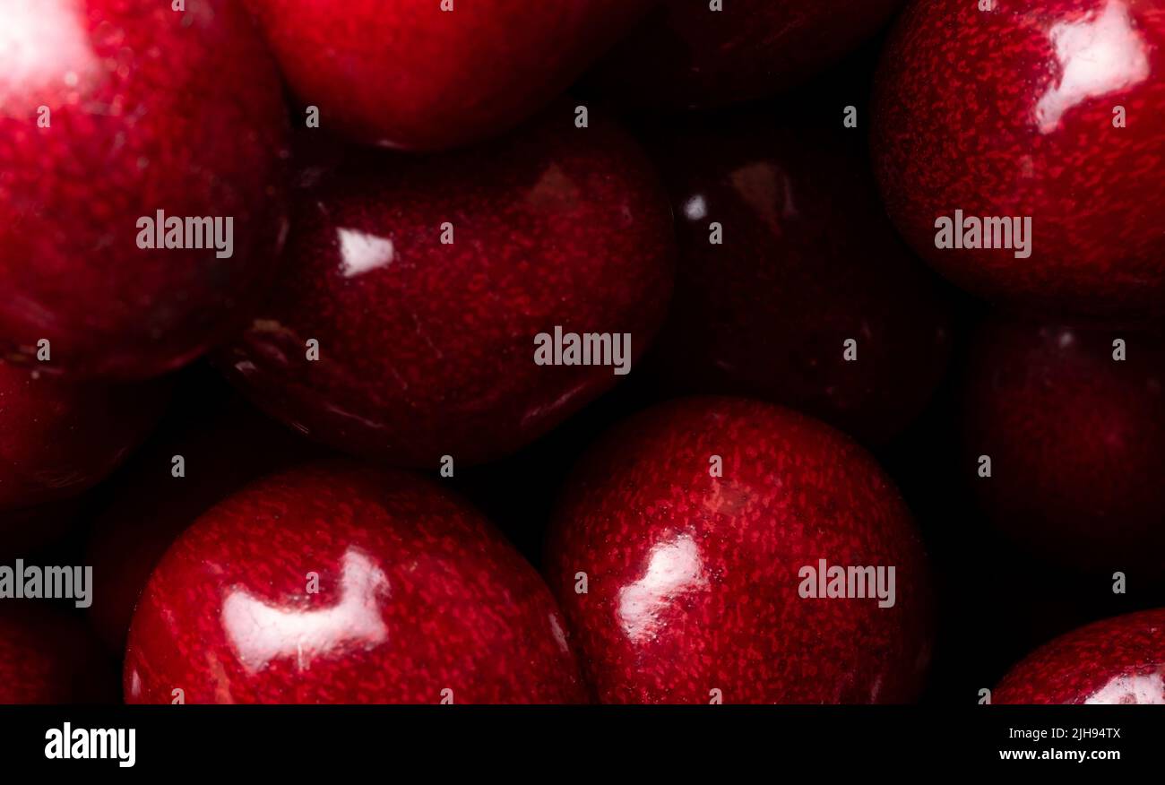 Red juicy sweet cherries. Juicy maroon fruit close-up. Cherries in ...