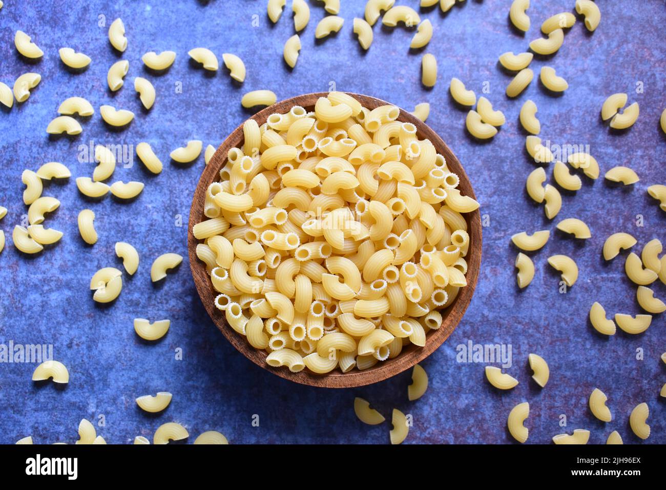 Raw whole dried ridged elbow macaroni pasta Stock Photo - Alamy